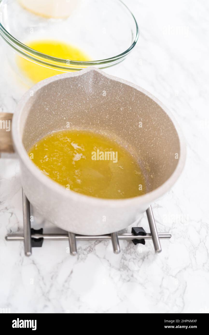 Melted sticks of unsalted butter on the counter Stock Photo - Alamy