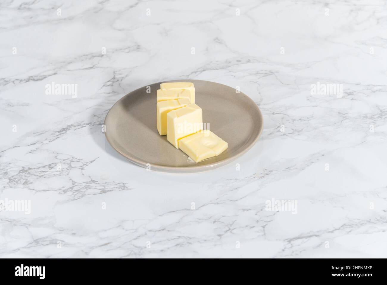 Softened sticks of unsalted butter on the kitchen counter Stock Photo ...