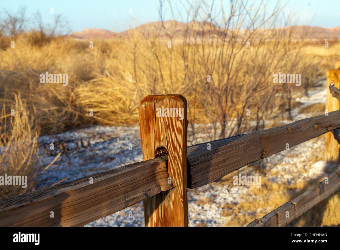 Wooden fence post and railing at a rural desert area in Southern Nevada ...