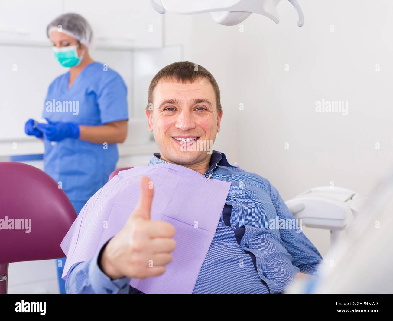 portrait of male visitor sitting Stock Photo - Alamy