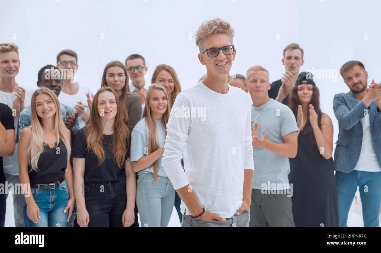 casual guy standing in front of a diverse group of young people Stock ...