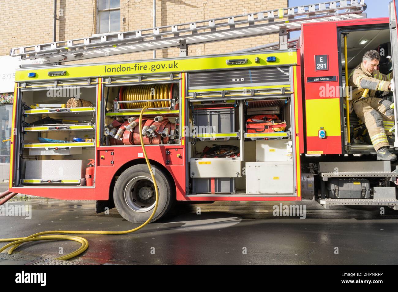 Side view of fire engine equipment compartment hi-res stock photography ...