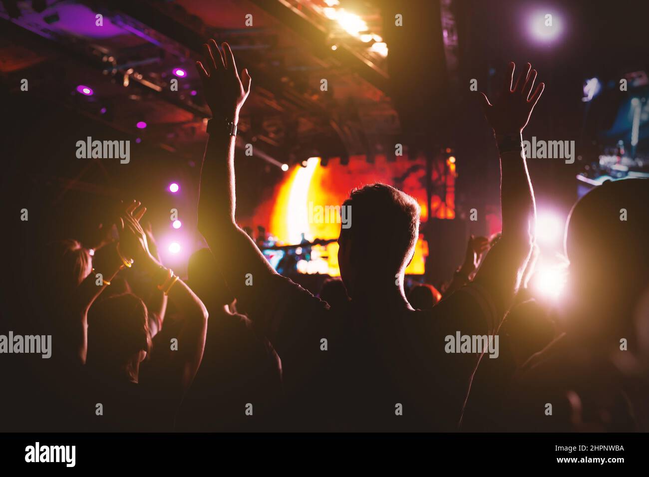 Rock concert, silhouettes of happy people raising up hands Stock Photo ...