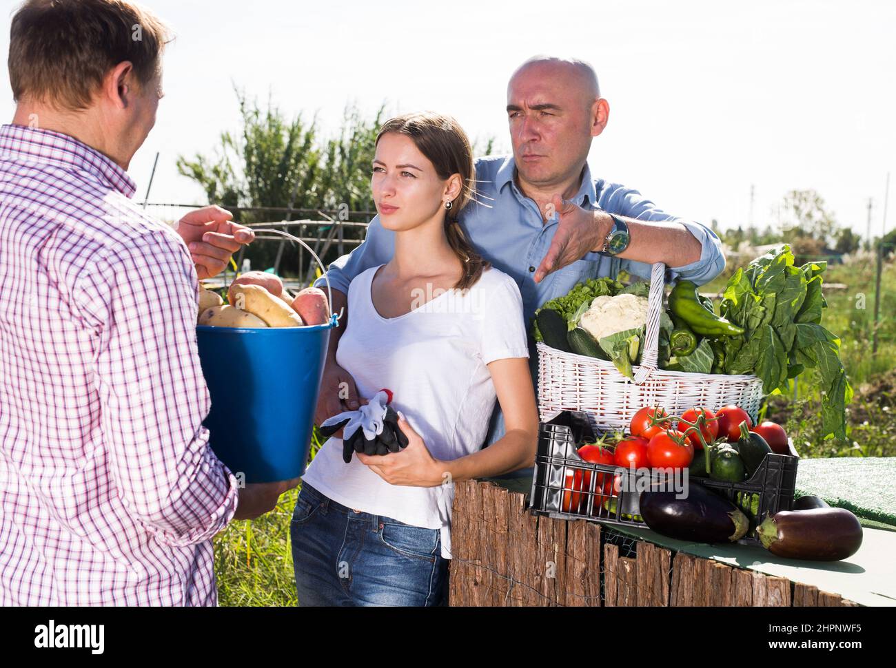 Angry neighbors quarrel on the border of the garden Stock Photo - Alamy