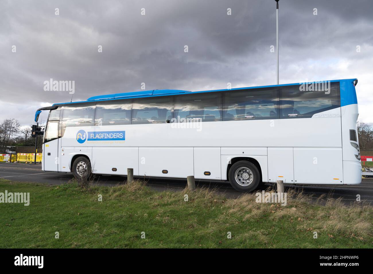 White FLAGFINDERS coach drive on road A2 in Greenwich Area UK Stock ...