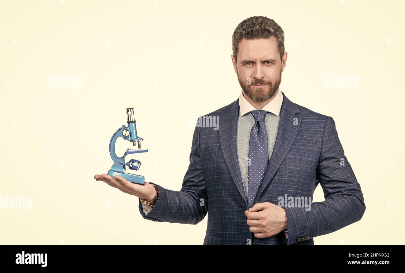 future. unique medicine invention. businessman presenting microscope ...