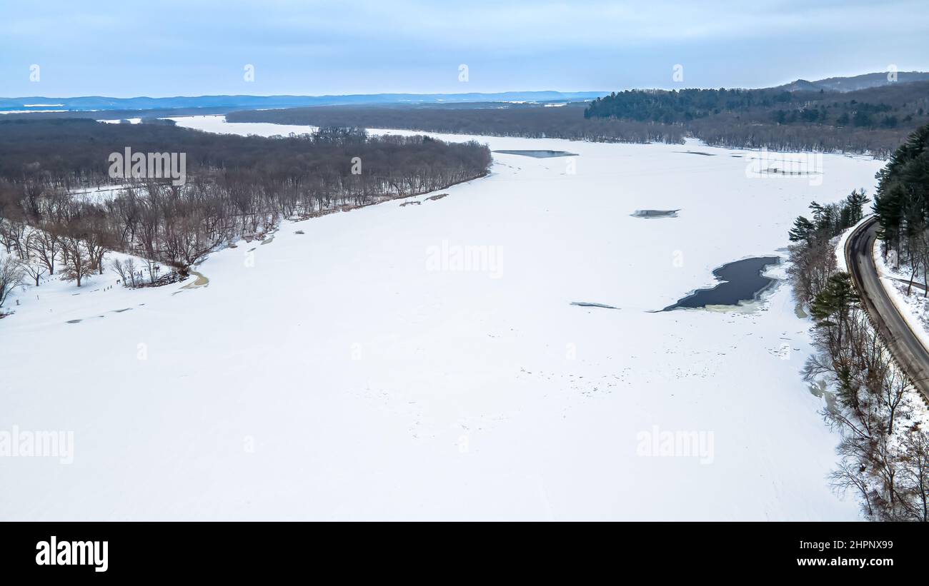 Icy cold river with road along side of it Stock Photo - Alamy
