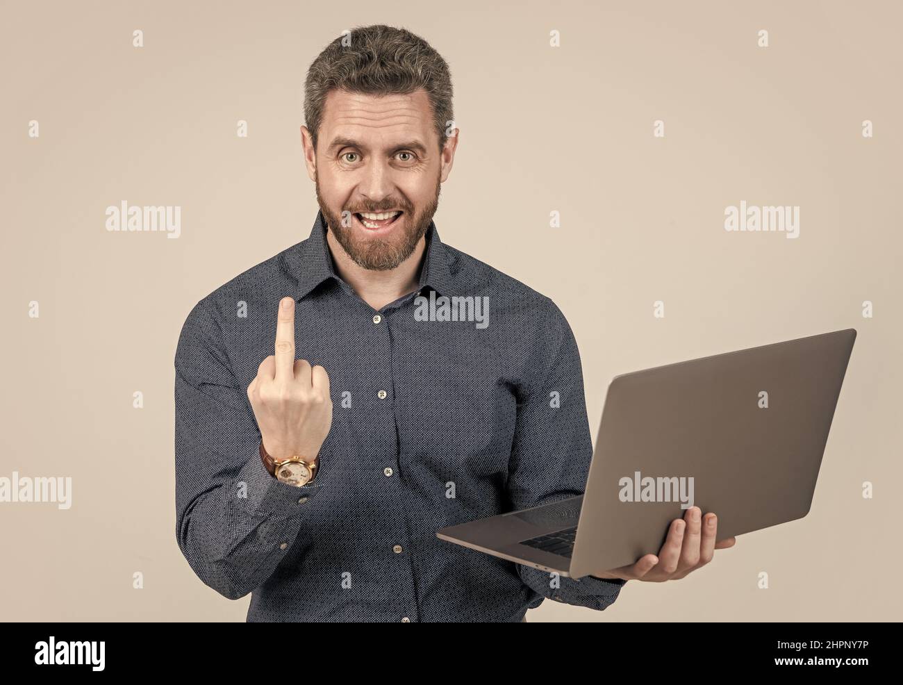 mature businessman show middle finger gesture. business success. programmer man use pc ...