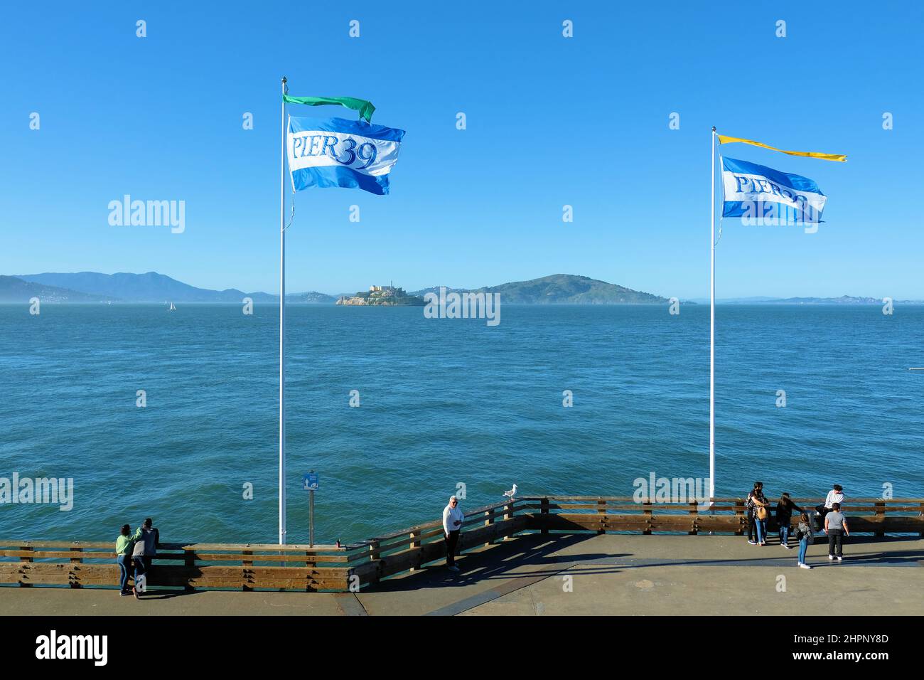 Alcatraz Island seen through the Pier 39 flags on the boardwalk in San ...