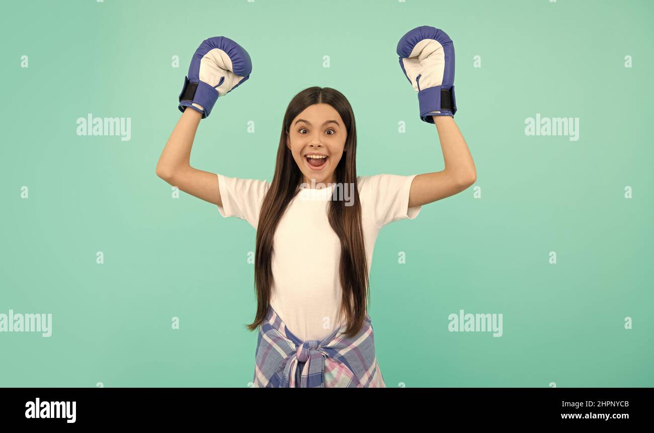 happy kid boxer celebrate victory in boxing gloves during sport ...