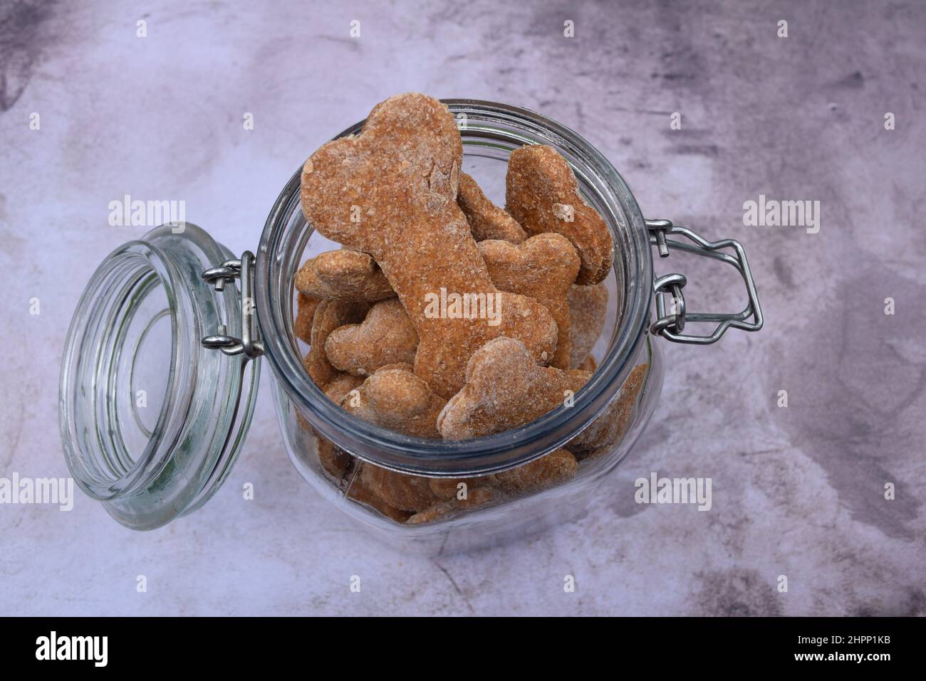 Homemade "bone shaped" dog treats in glass container Stock Photo - Alamy