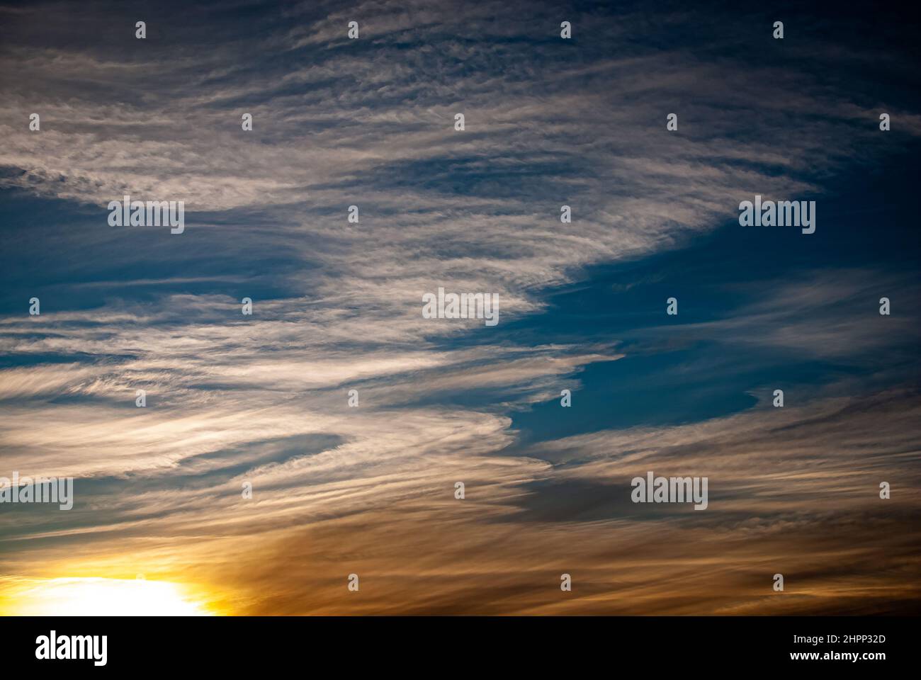 A majestic winter sunset with clouds like wings Stock Photo - Alamy