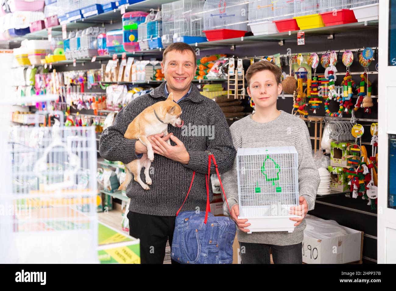 Father and son shop at the pet store Stock Photo - Alamy