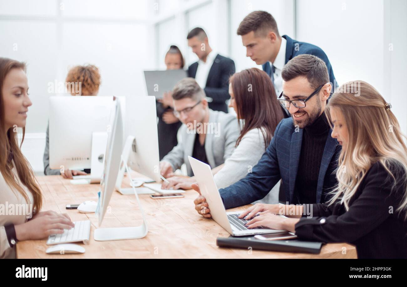 professional employees work on computers in a modern office. photo with ...