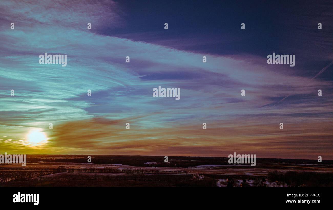 A majestic winter sunset with clouds like wings Stock Photo - Alamy
