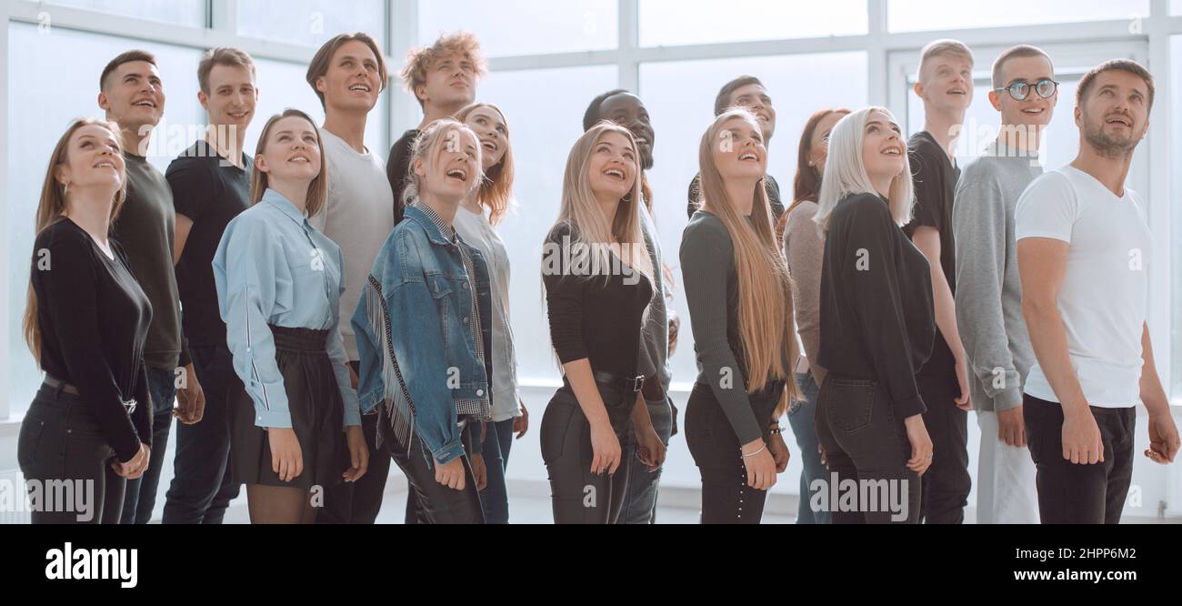 side view. organized group of casual young people looking up Stock ...