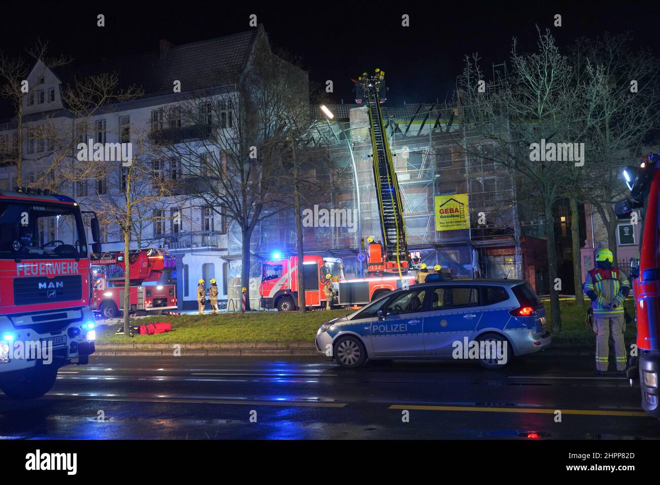Berlin, Germany. 23rd Feb, 2022. Firefighters extinguish the fire in a ...