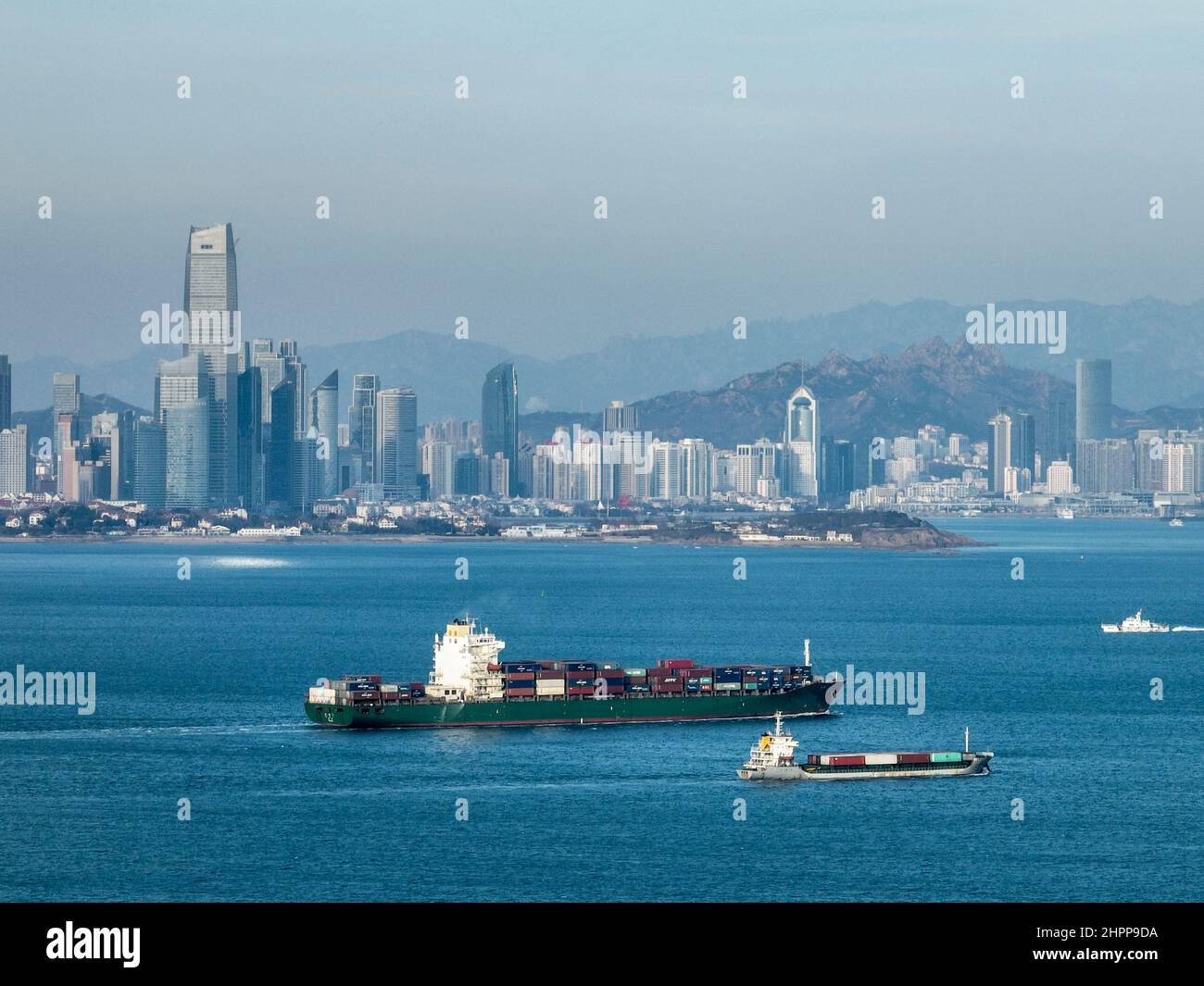 QINGDAO, CHINA - FEBRUARY 22, 2022 - A container ship enters and leaves ...