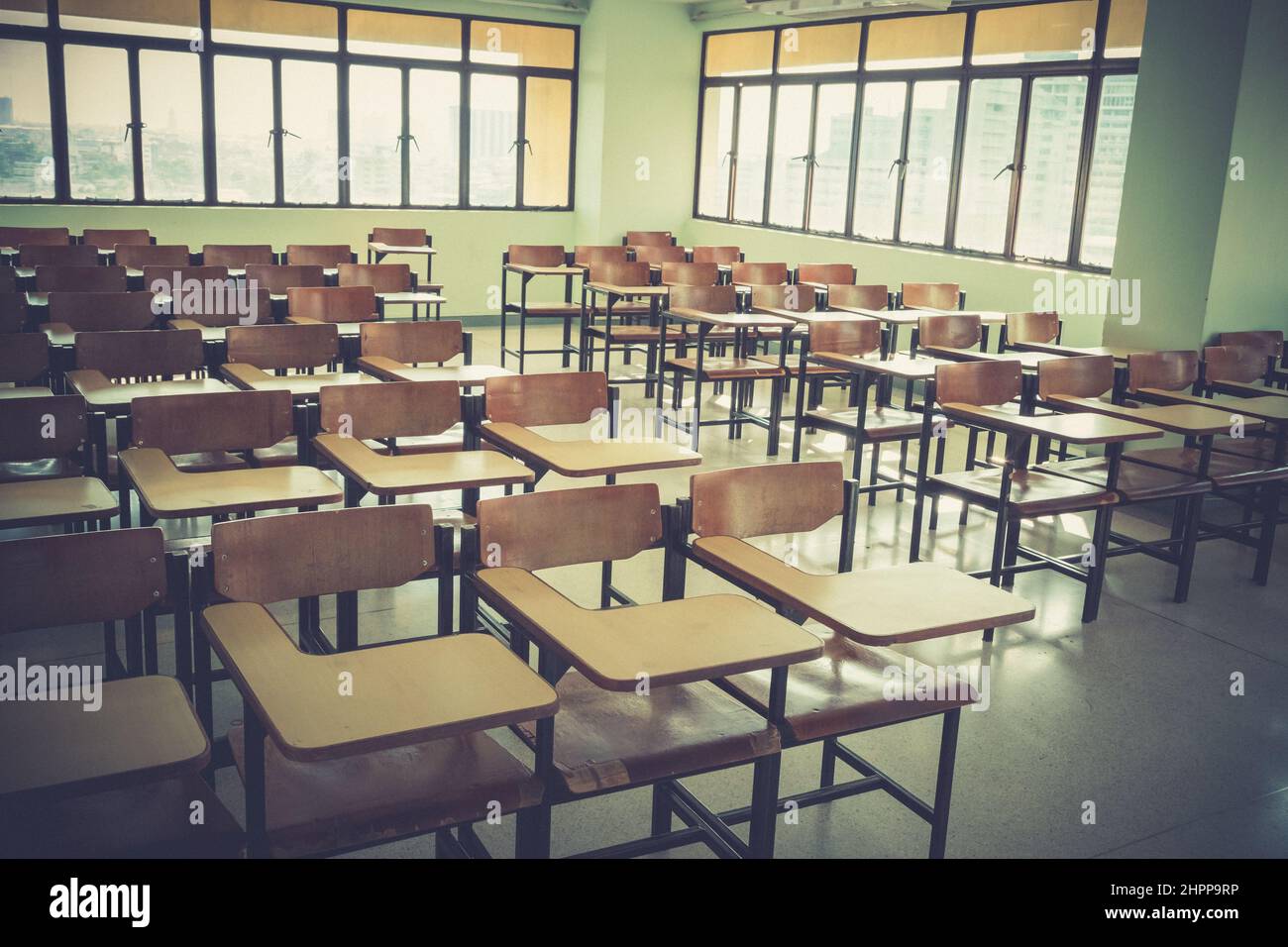 Vintage image of Desk and chairs in classroom background Stock Photo ...