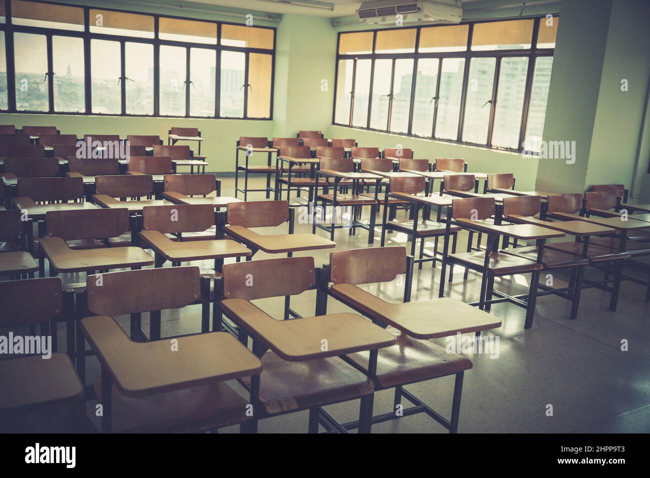 Vintage image of Desk and chairs in classroom background Stock Photo ...