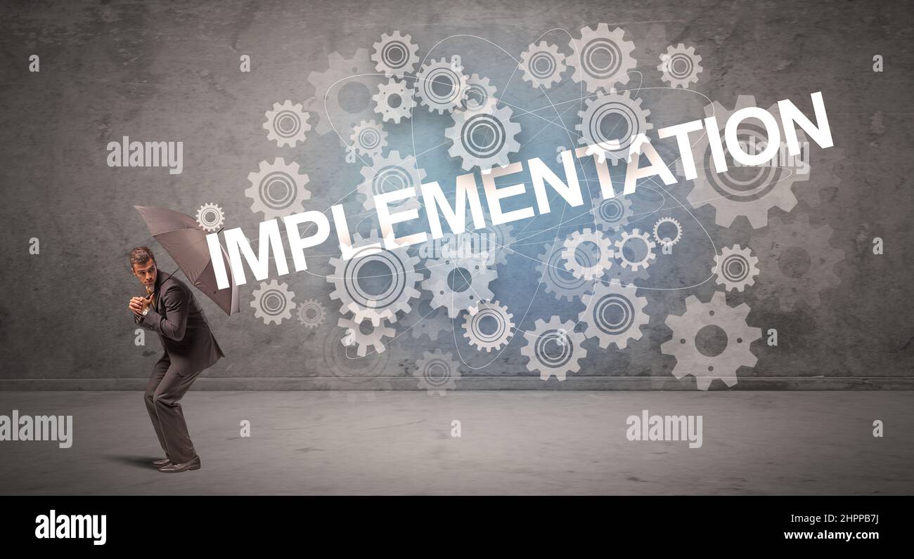 Businessman defending with umbrella Stock Photo - Alamy