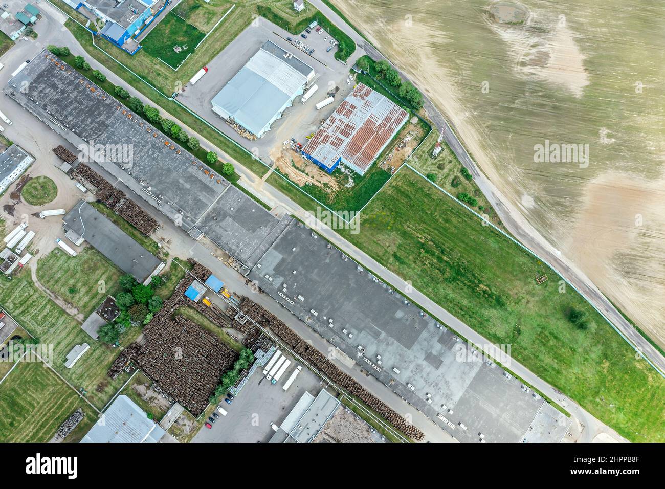 group of large industrial warehouses or factory buildings in suburban ...