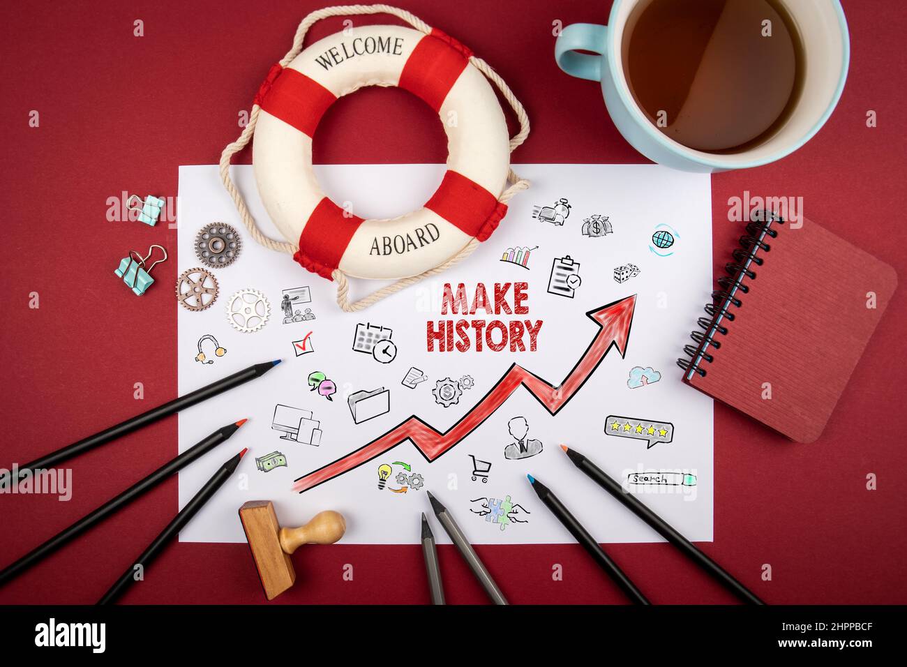Make History. Development curve in the notebook. Red office desk Stock ...
