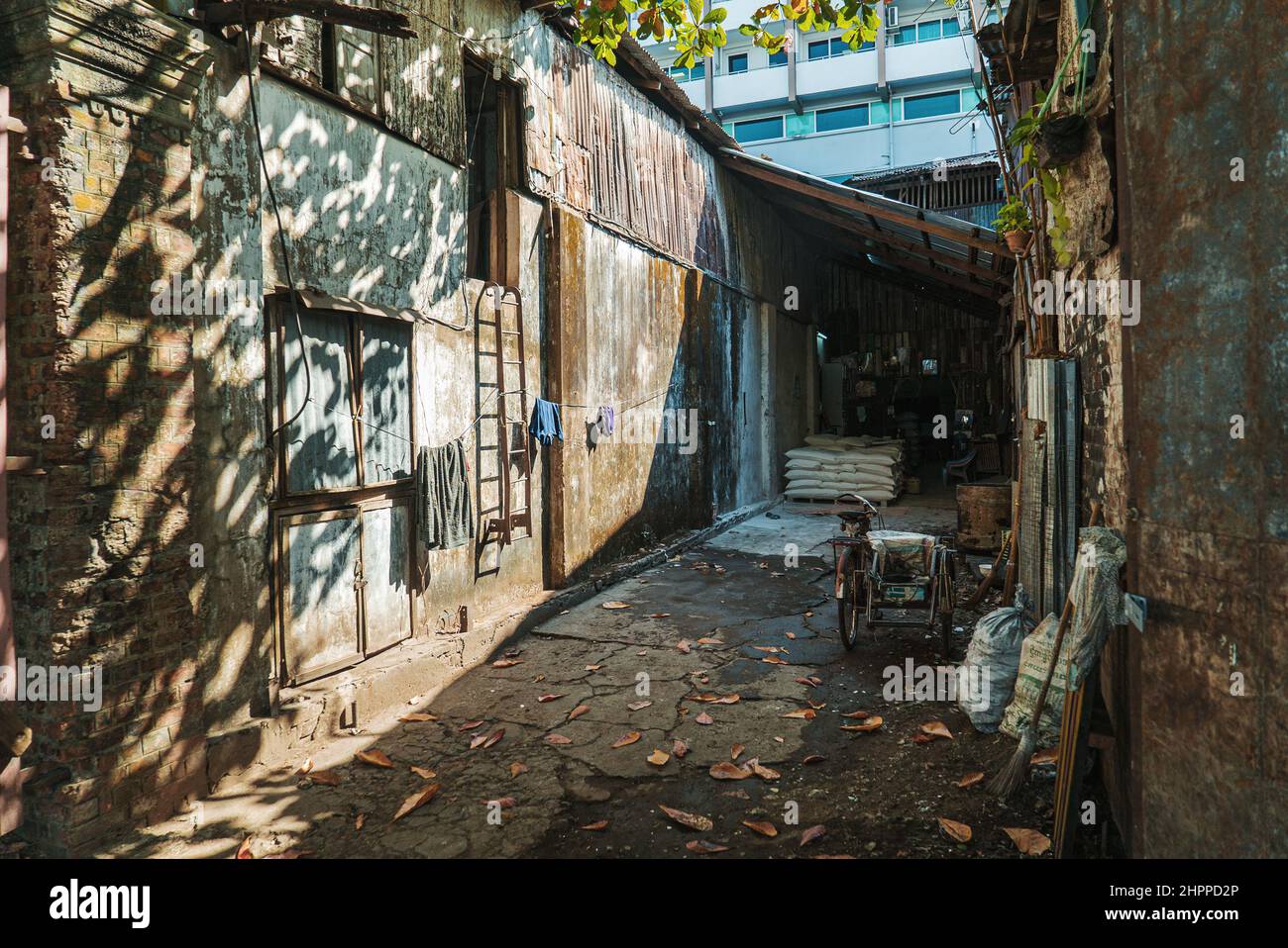 Side view of rural old grunge wooden walls with sunlight in Yangon ...