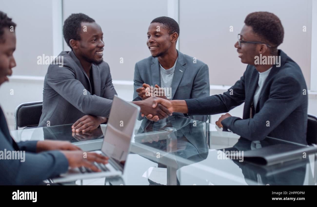 business partners greeting each other with a handshake. the concept of ...