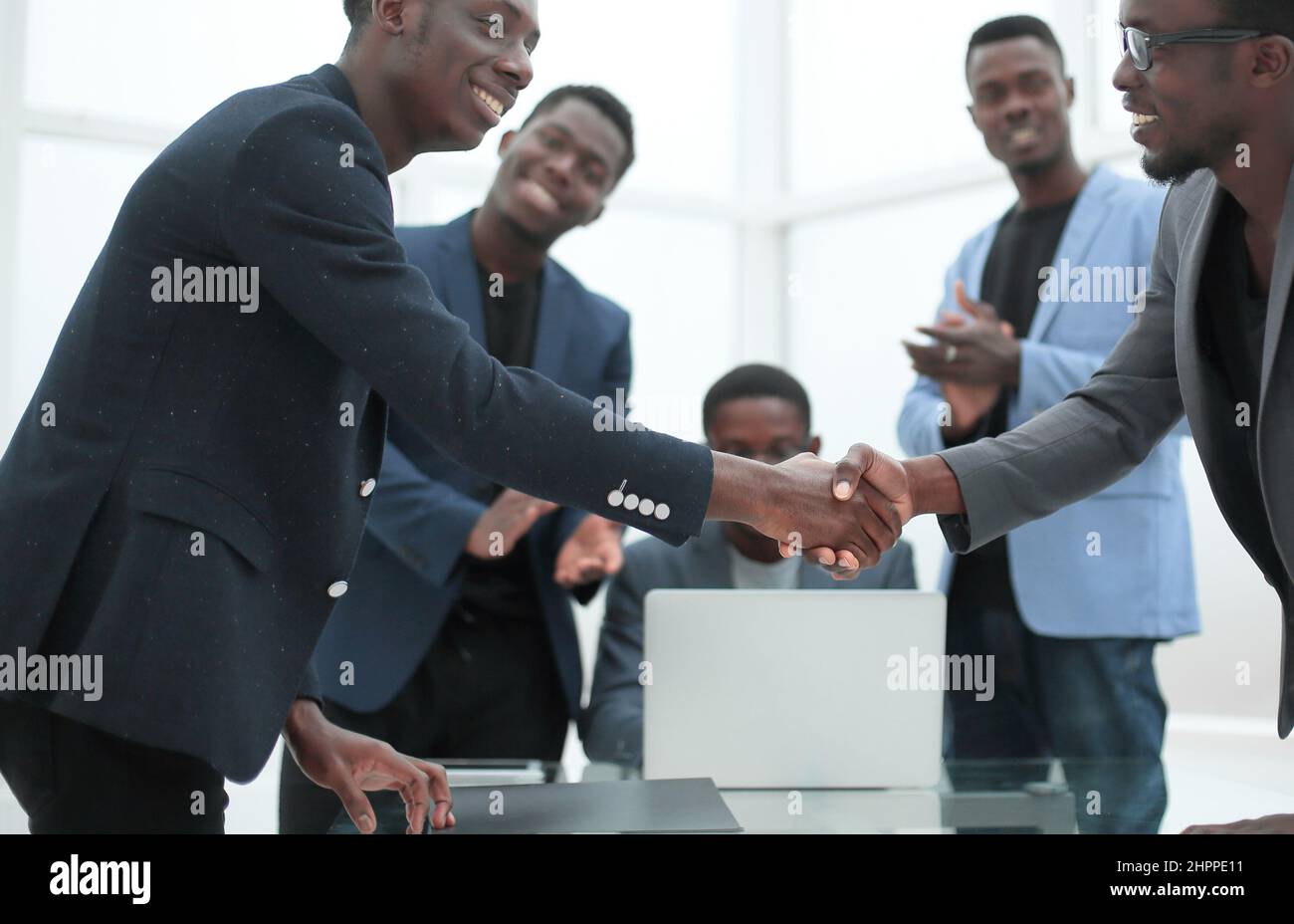 reliable handshake of business partners over the desktop. the concept ...