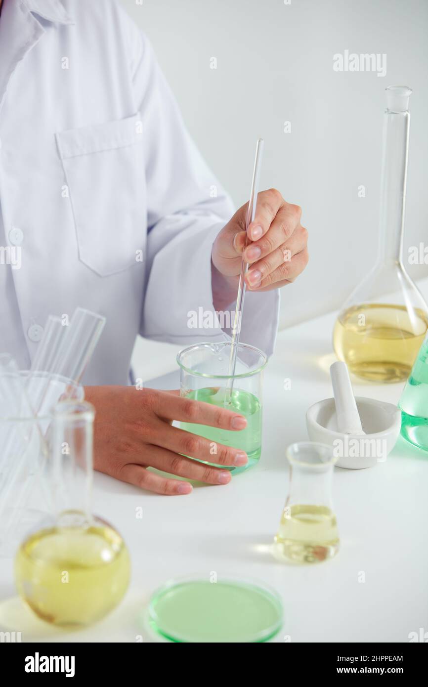 Plants extract in petri dish and a white background in laboratory ...
