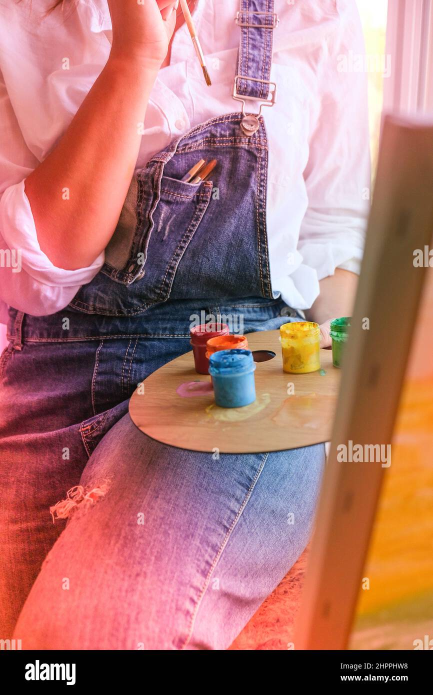 Creative painter in working process. Artist workplace, hobby, craft ...