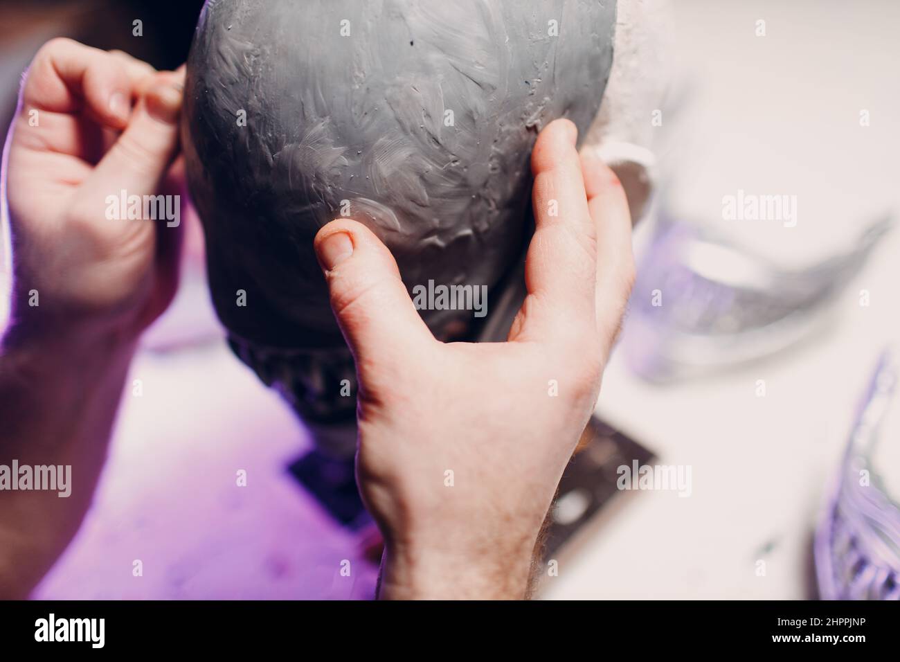 Artisan craftsman create mask based on plaster cast. Gypsum mold and ...