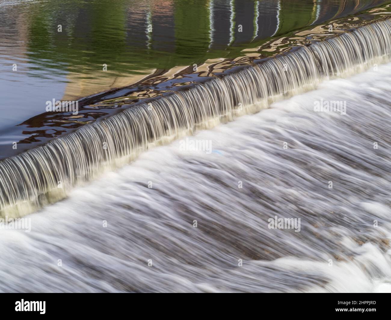 A small flat cascade in a calm river. Water background Stock Photo - Alamy