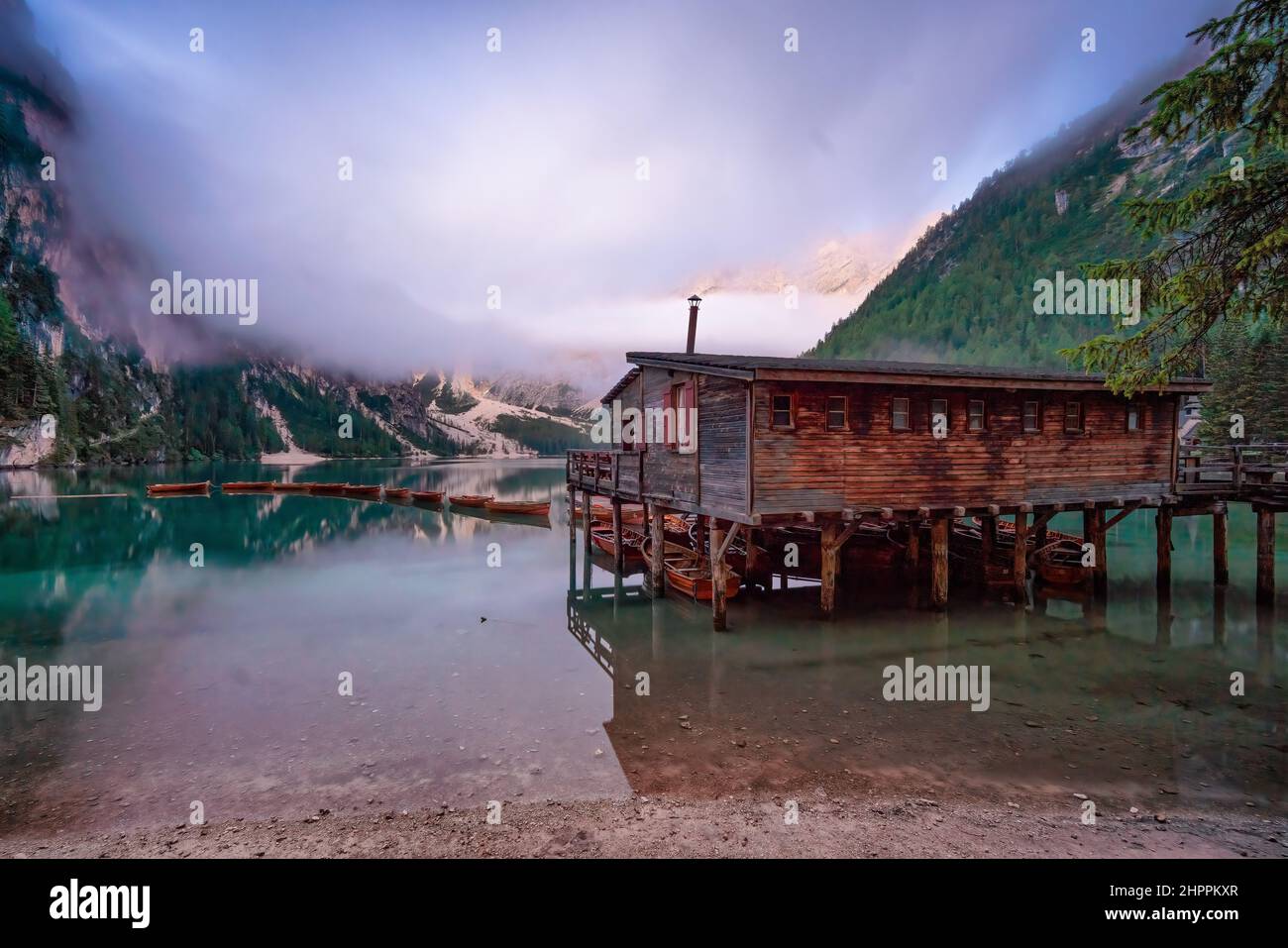 Hut and boats on the blue Pragser Wildsee in the Italian Dolomites ...