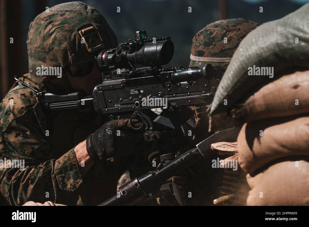 A U.S. Marine with the Advanced Machine Gun course fires a M240G medium ...