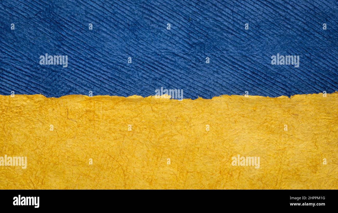 paper abstract in colors of Ukrainian national flag - blue and yellow ...