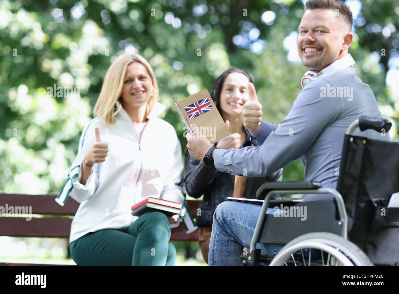 Group of young people are learning English in park Stock Photo - Alamy