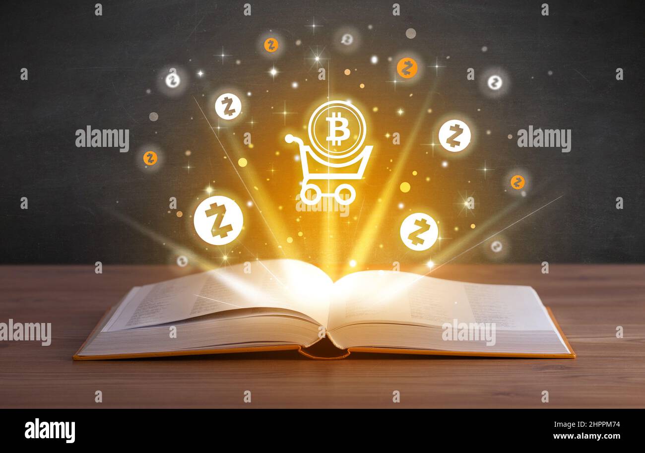 Open book with currency icons above Stock Photo - Alamy