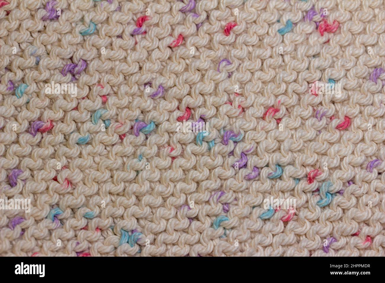Full frame abstract texture background of hand knitted cotton yarn in a ...