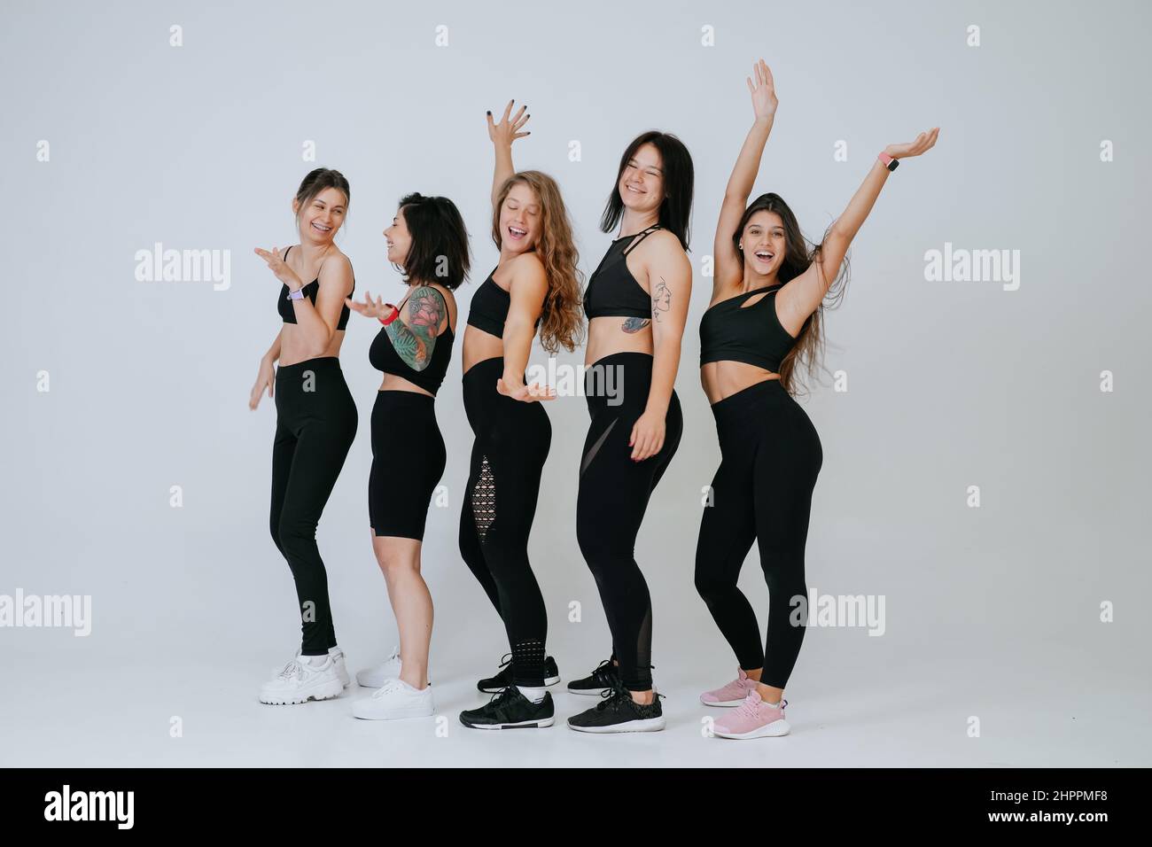 diverse models laughing, enjoying time together, look at camera Stock ...