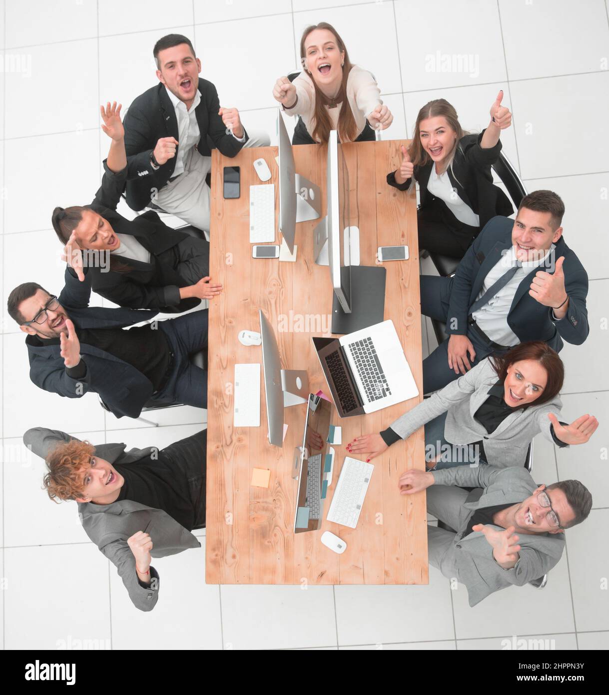 team of young professionals looking at the camera Stock Photo - Alamy