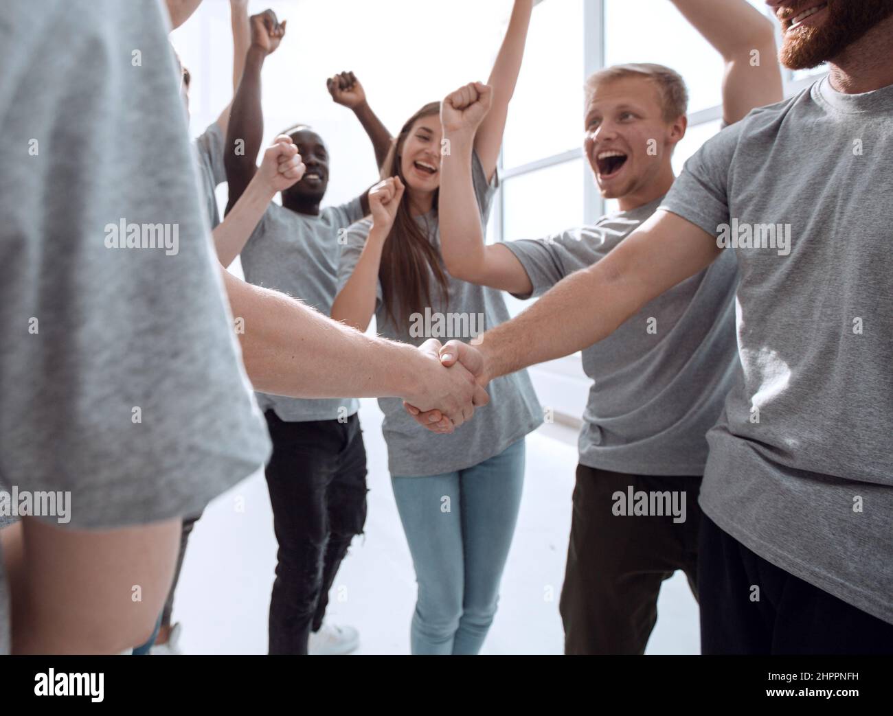 young people congratulating each other on the victory Stock Photo - Alamy