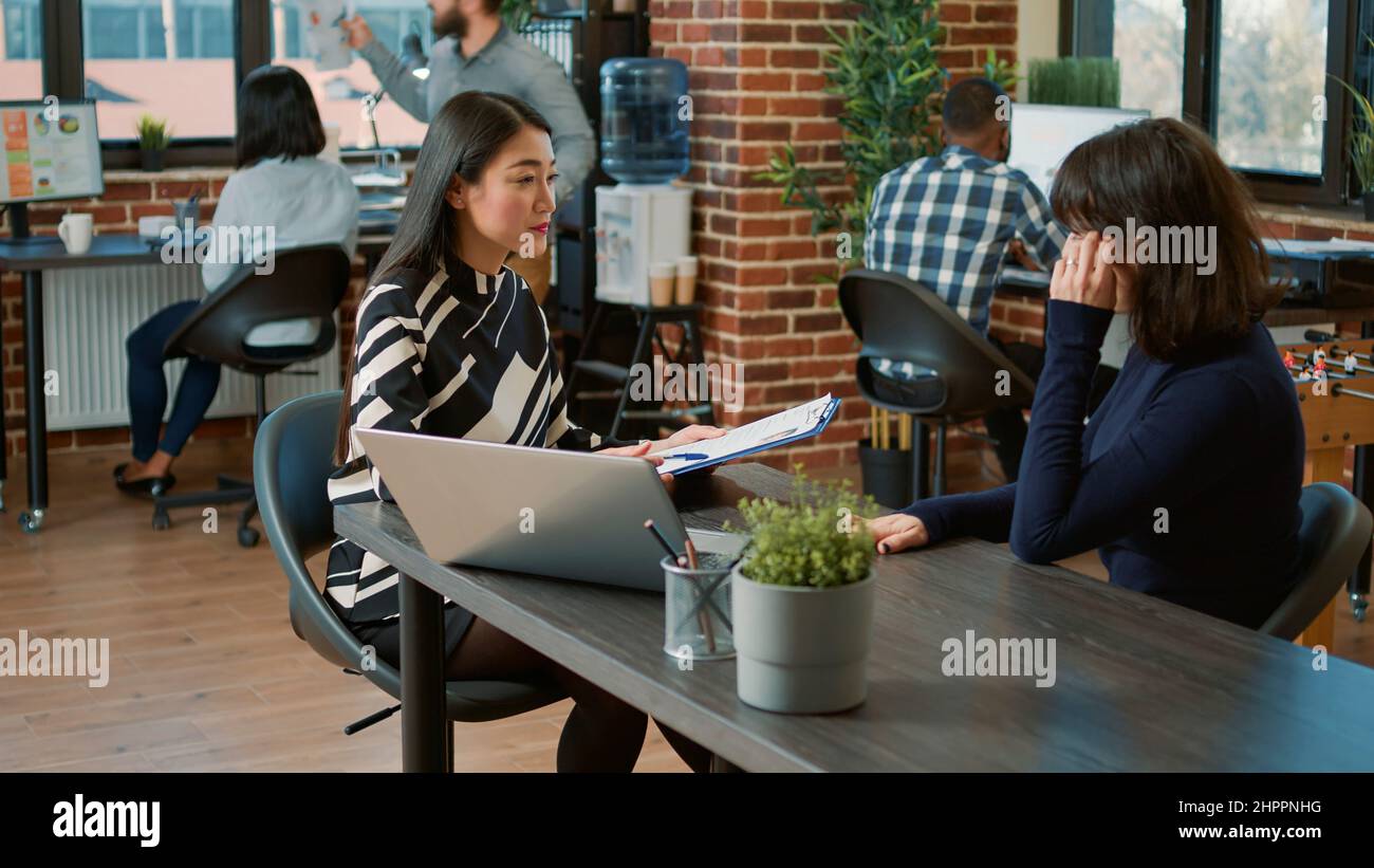 Female employee and candidate greeting at job interview appointment ...