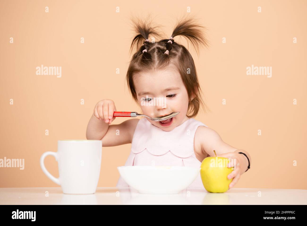 Cute baby child eat food, babies eating. Kid eating healthy food with a ...