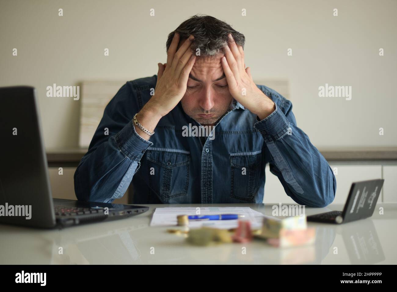 man checking his bills at home Stock Photo - Alamy