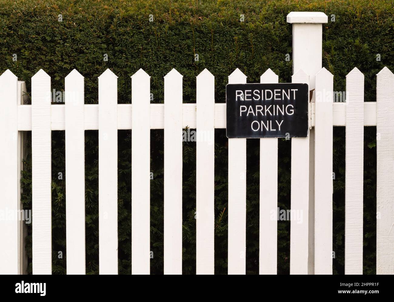 Parking for residents only sign on a white wooden fence Stock Photo - Alamy