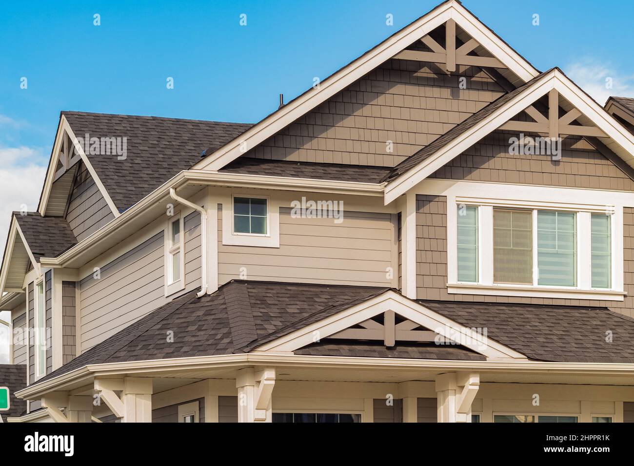 The roof of the house with nice window in sunny day. Street view ...