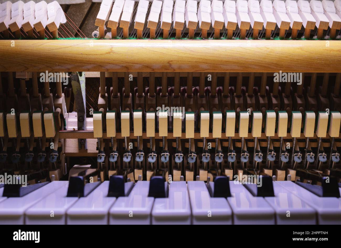 Details of an open upright piano, strings and structure closeup view ...