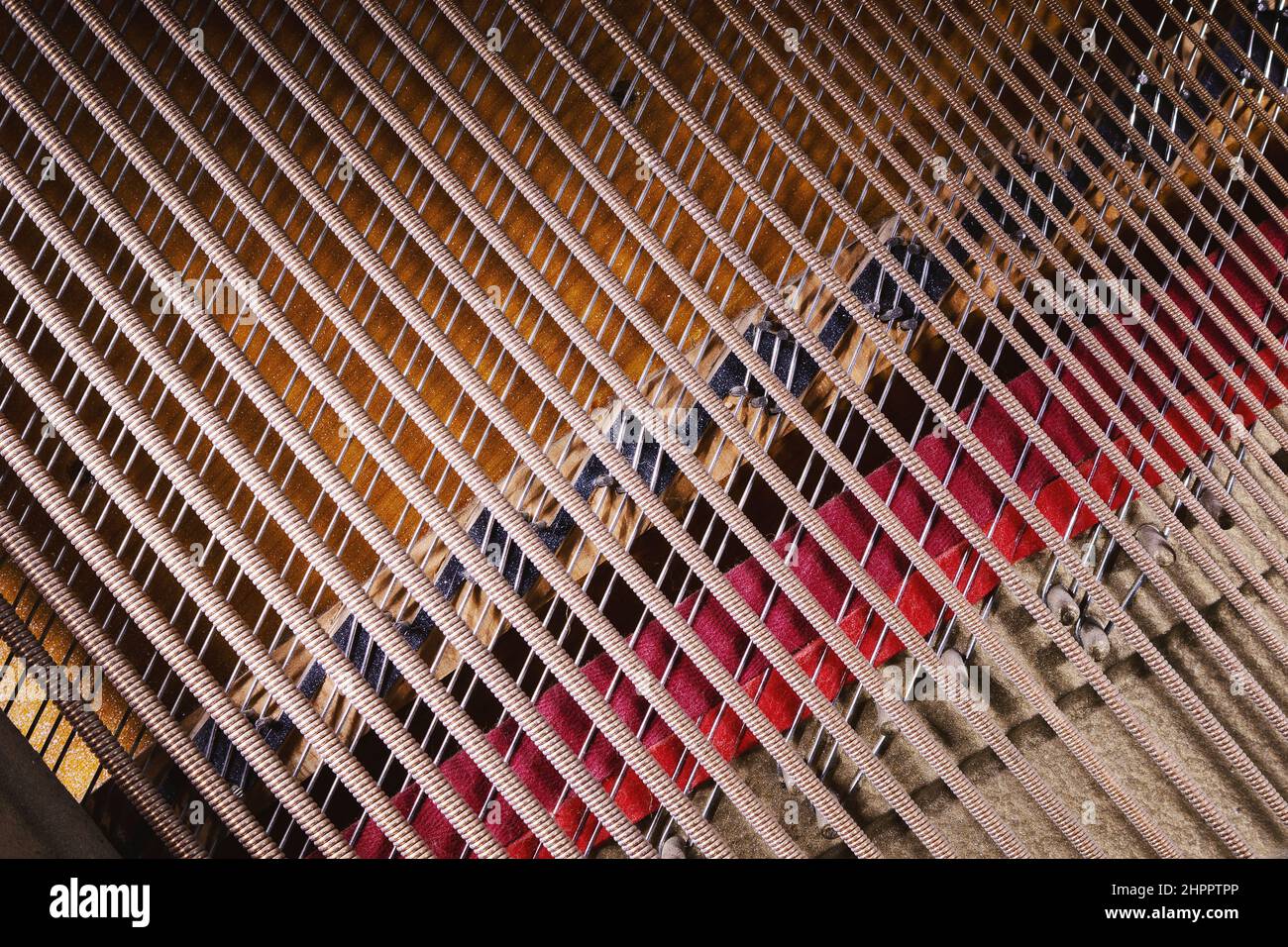 Details of an open upright piano, strings and structure closeup view ...